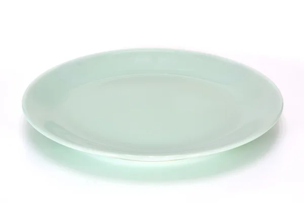 White empty plate ( oval dish ) over a white background. — Stock Photo ...
