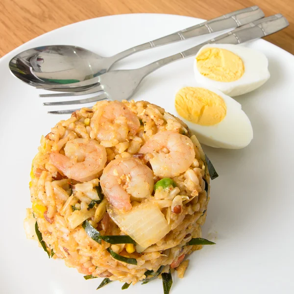 Khow Pat Tom Yum Koong - Stir fried spicy rice with herbs and p - Stock ...