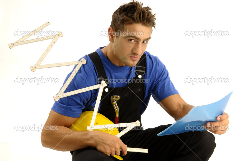 Young worker reading instructions Stock Photo by ©vojtechvlk 12257046