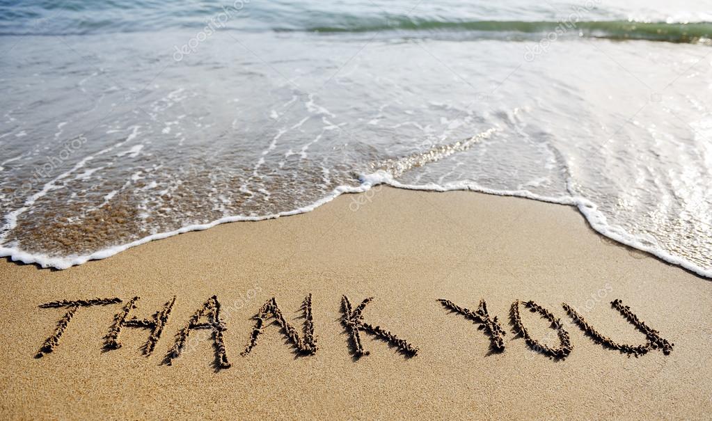 Thank you word drawn on the beach sand — Stock Photo © TaniaLerro #50037555