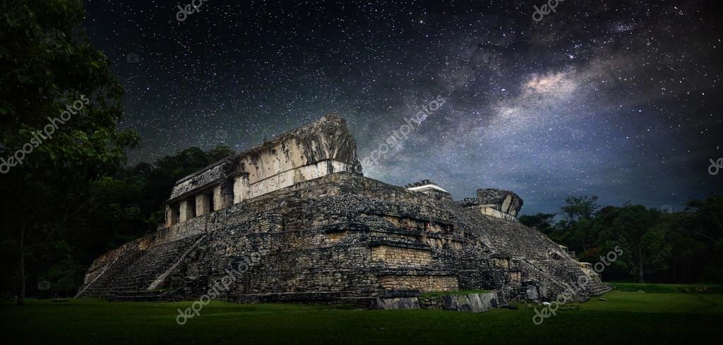 Galactic night starry sky over the ancient Mayan city of Palenqu ...