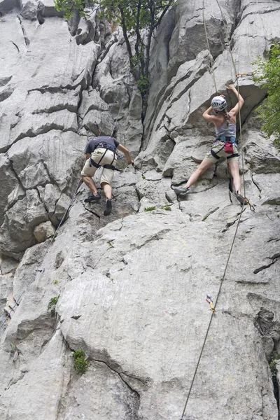 Risk rock climbing safety two people Stock Photos, Royalty Free Risk ...