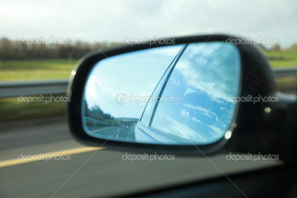 Rear view on a car mirror, road Stock Photo by ©Voyagerix 21264215
