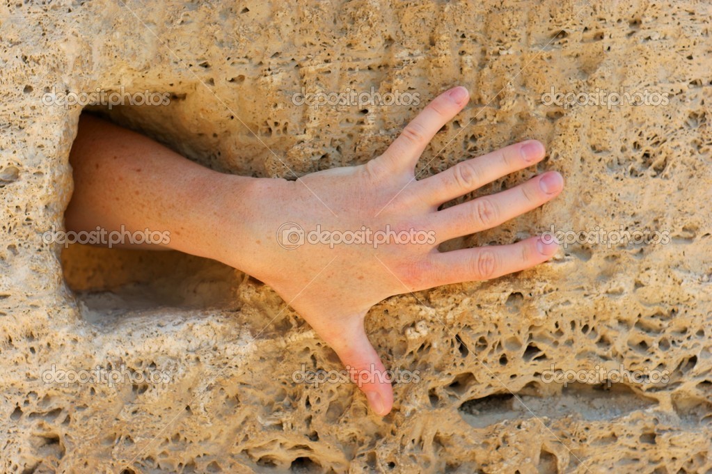 Texture of stone wall and female hand Stock Photo by ©Voyagerix 21647225