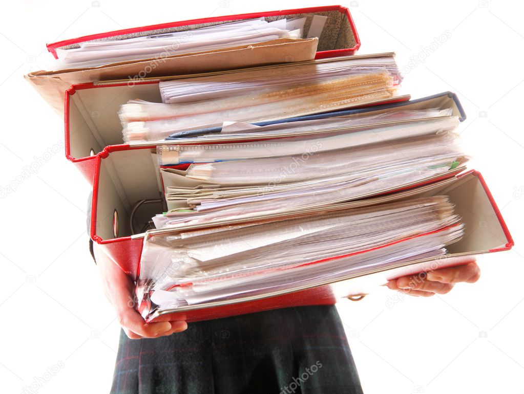 Female office worker carrying a stack of files Stock Photo by ...