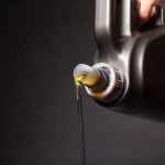 Can with car engine oil pouring black background Stock Photo by ...