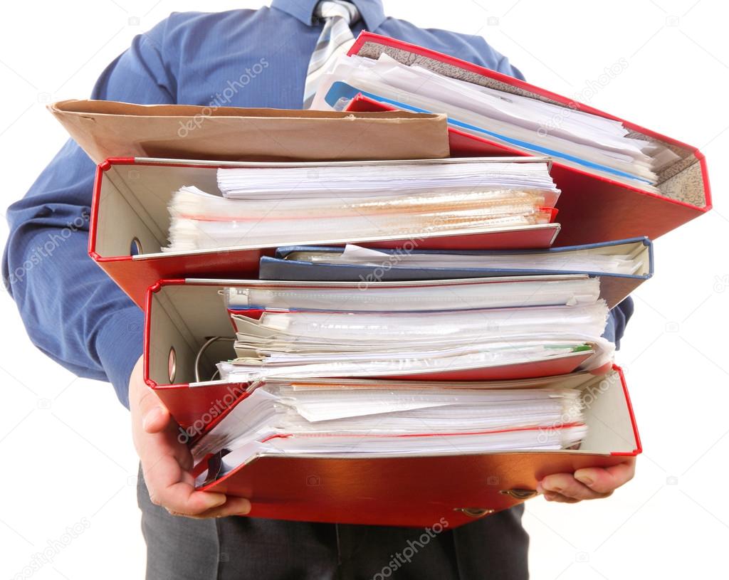 Male office worker carrying a stack of files Stock Photo by ©Voyagerix ...