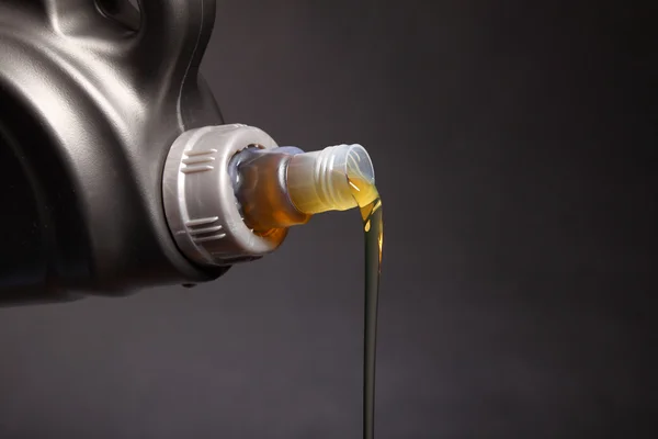 Can with car engine oil pouring blue background ⬇ Stock Photo, Image by ...