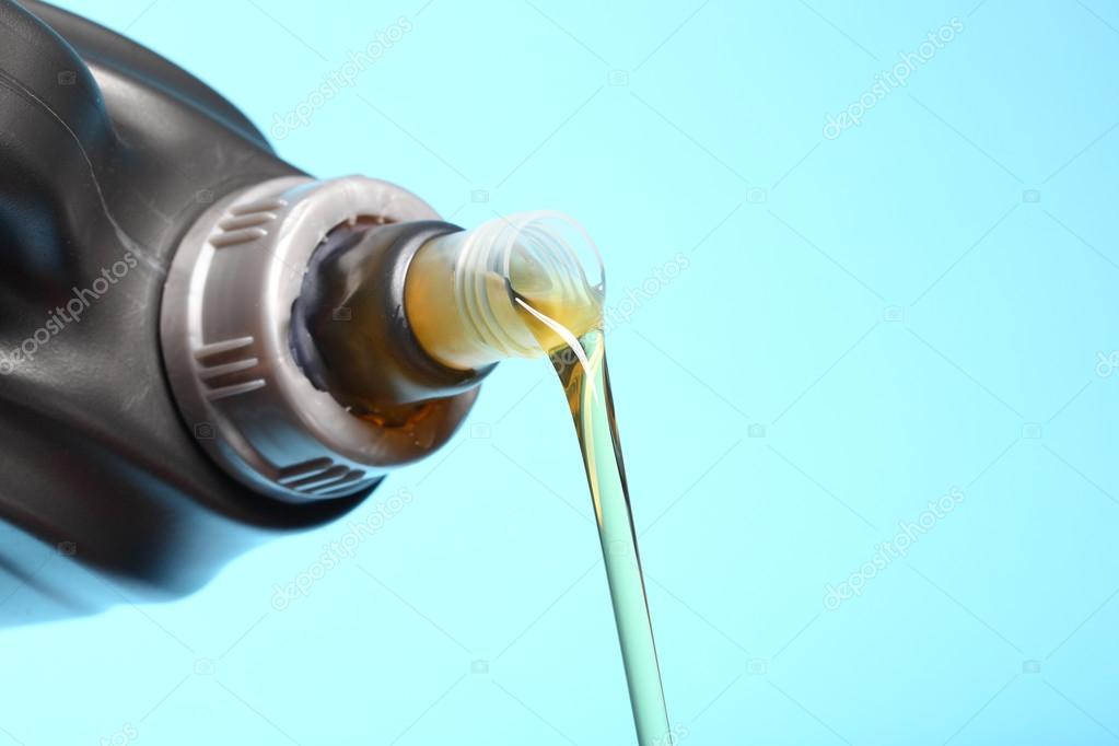 Can with car engine oil pouring blue background ⬇ Stock Photo, Image by ...