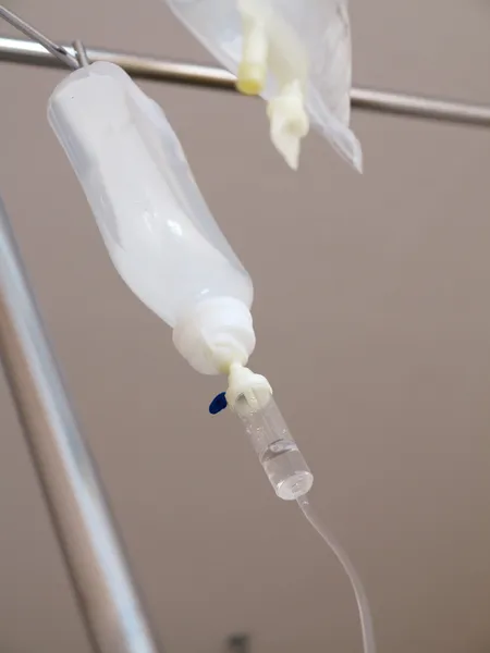 Infusion bottle with IV solution in hospital Stock Photo by ©Voyagerix ...