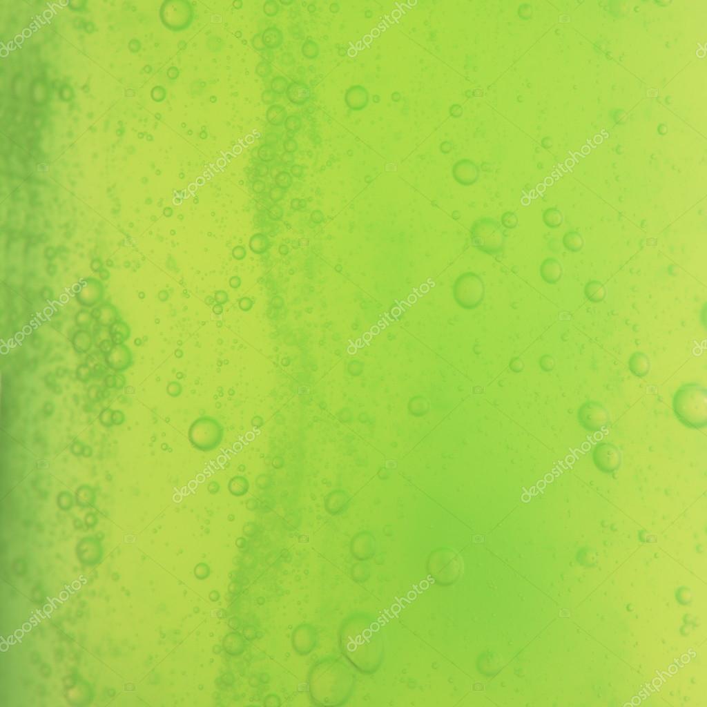 Soap bubbles green liquid background Stock Photo by ©Voyagerix 31863887