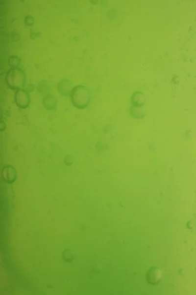 Soap bubbles green liquid background Stock Photo by ©Voyagerix 31863887