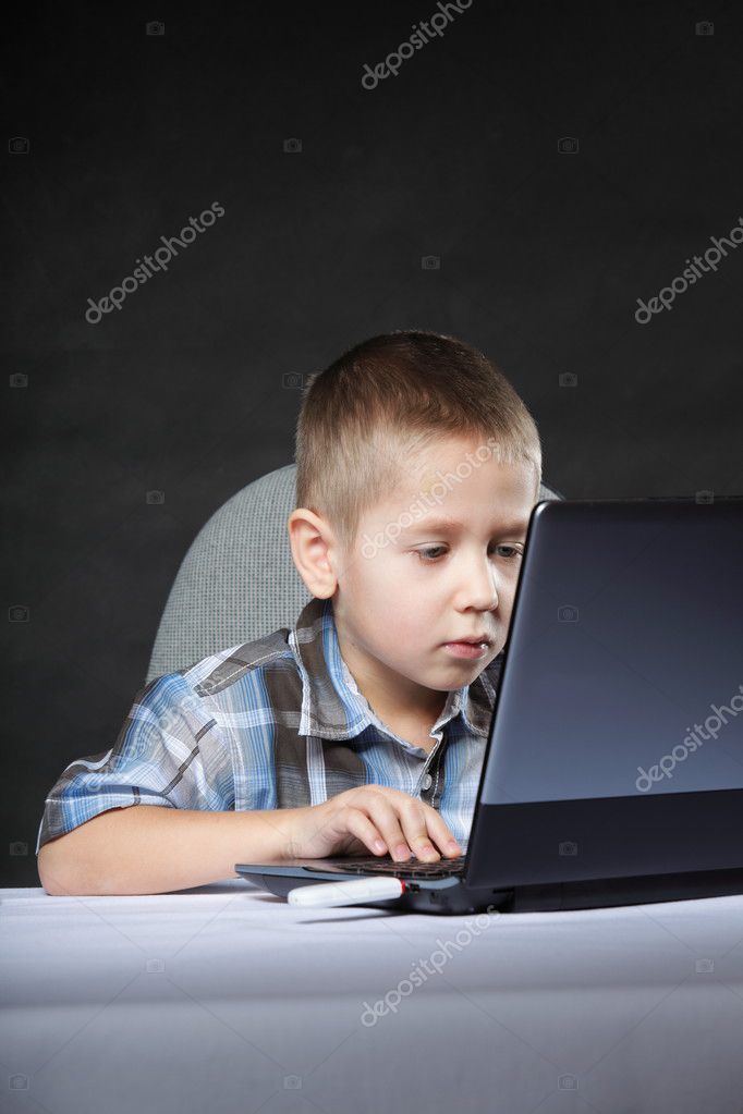 Computer addiction child with laptop notebook Stock Photo by ©Voyagerix ...