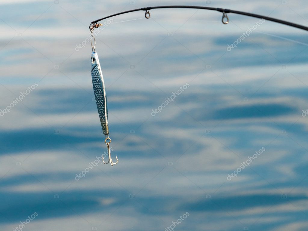 Rod with wobbler and blue sea Stock Photo by ©Voyagerix 51074477