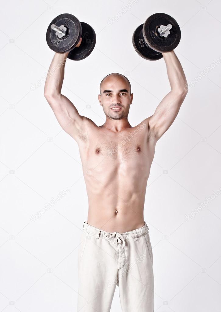 Strong man lifting the weights up. — Stock Photo © luanateutzi #35290793
