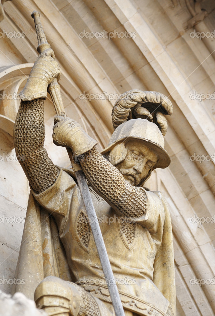 Medieval knight killing a dragon from gothic facade of public ...