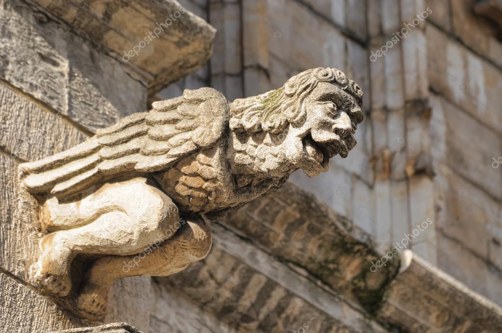 Laughing Gargoyle figure decorating medieval Town Hall in Brussels ...
