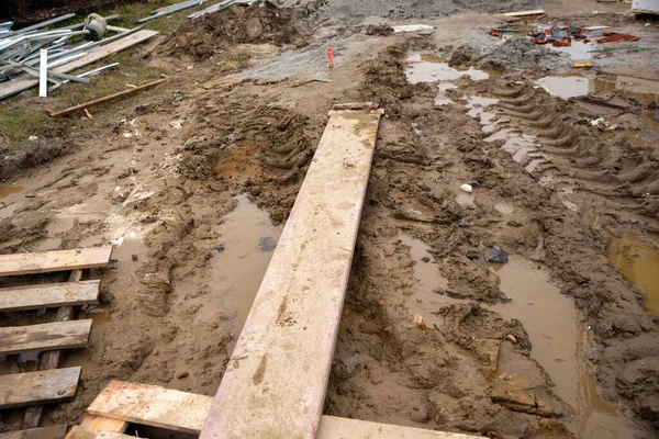 A large puddle after rain at the construction site - Stock Image ...