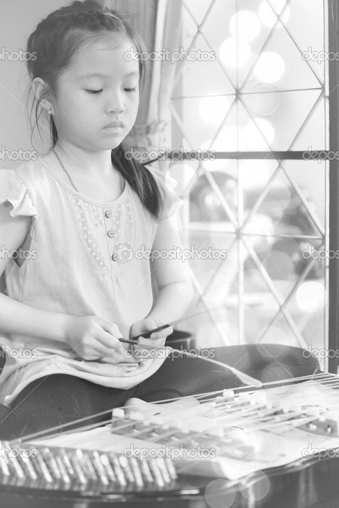 Girl playing musical instrument — Stock Editorial Photo © actionbleem ...