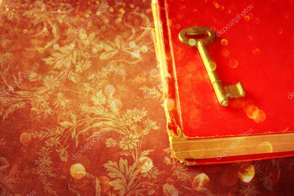 Red book and vintage key and golden glitter lights Stock Photo by ...