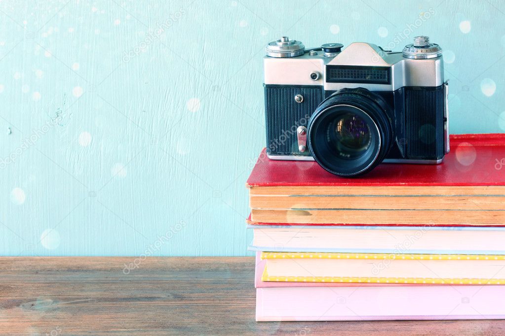 Vintage camera over stack of books — Stock Photo © tomert #41845803