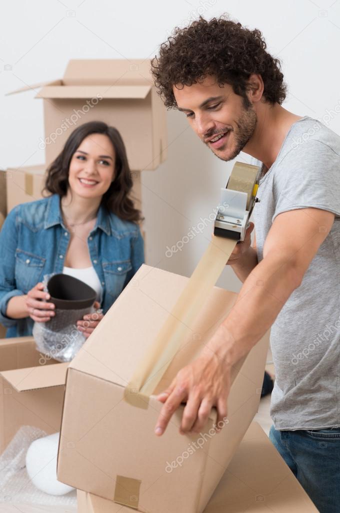 Man Packing Box With Sellotape Stock Photo by ©ridofranz 50521109