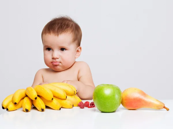 Happy baby with fruits — Stock Photo © fisechko #13415841