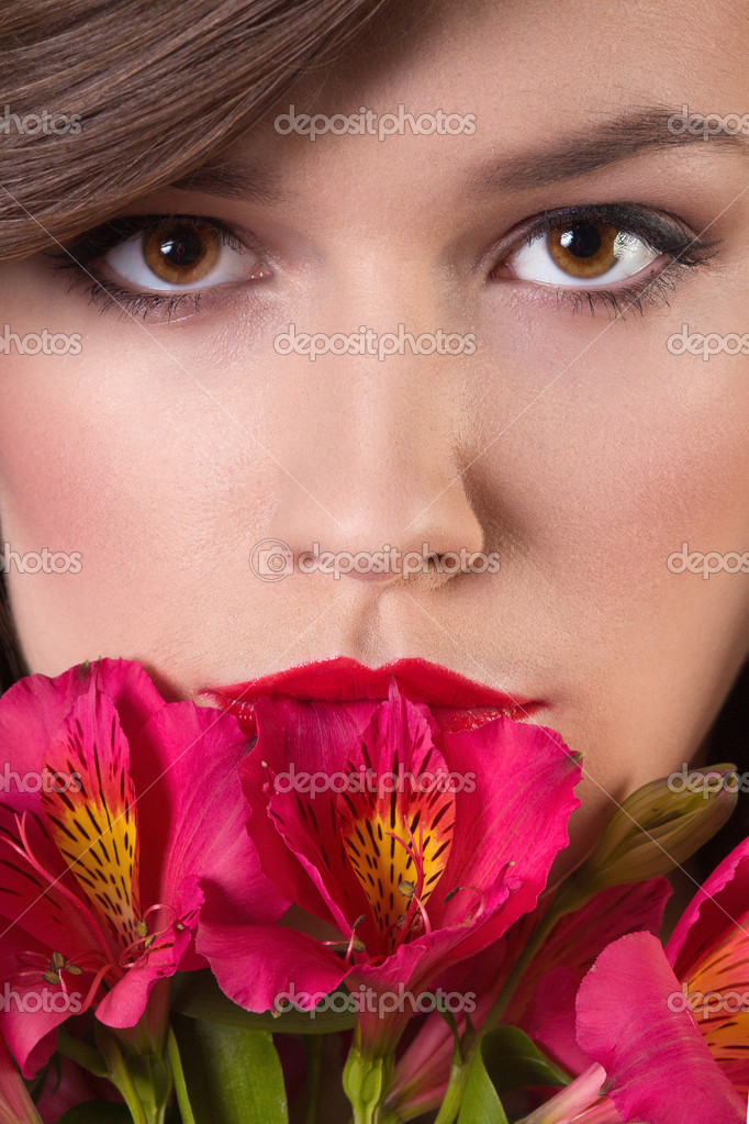 Beautiful woman face with a flower Stock Photo by ©7380photostudio 41546257