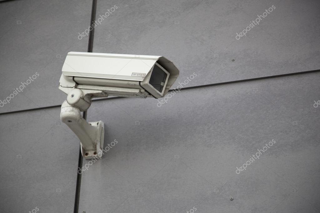 Surveillance camera on a grey wall — Stock Photo © varde64 #12606865