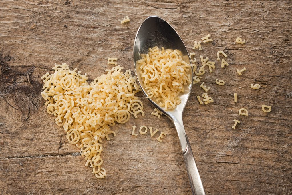 Noodles with a spoon on the table Stock Photo by ©piolka 12506972