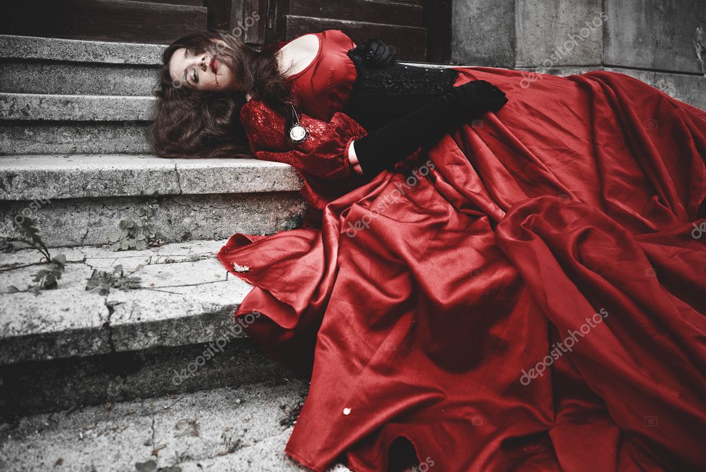 Lying and bleeding woman in a red Victorian dress — Stock Photo ...
