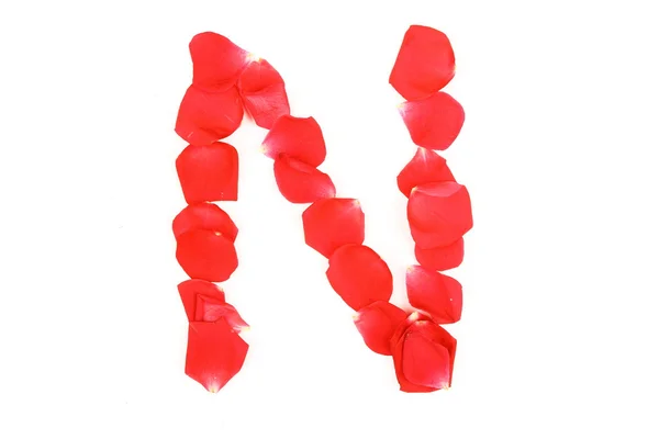 Beautiful made from red Rose petals Letter isolated on a white b Stock ...