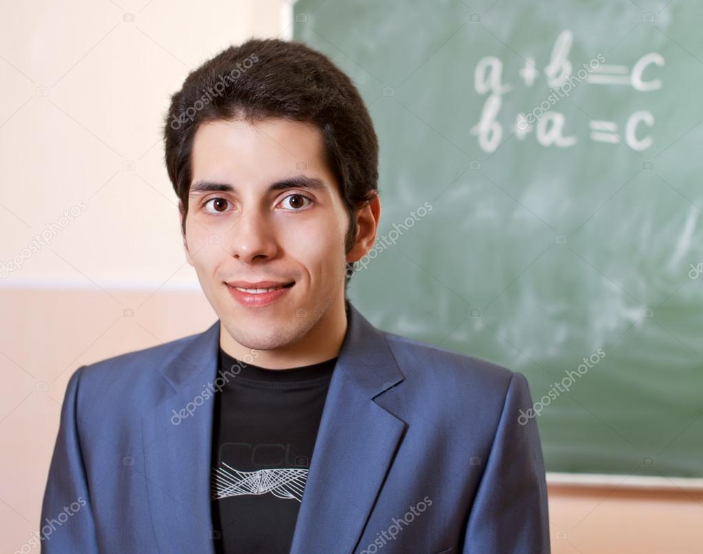Confident young teacher — Stock Photo © evasilchenko #24144631 Confident young teacher — Stock Photo © evasilchenko #24144631