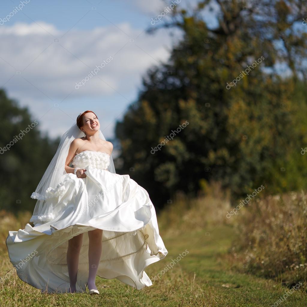Happy caucasian bride walking field. — Stock Photo © manifeesto_v #49924949