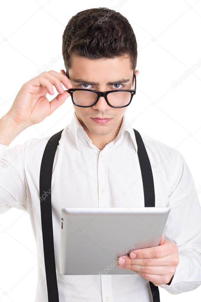 Serious project manager wearing eyeglasses using digital tablet Stock ...