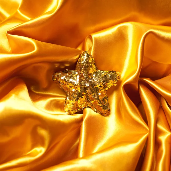 Golden glamour theme with sparkling christmas star on wavy golde ⬇ ...