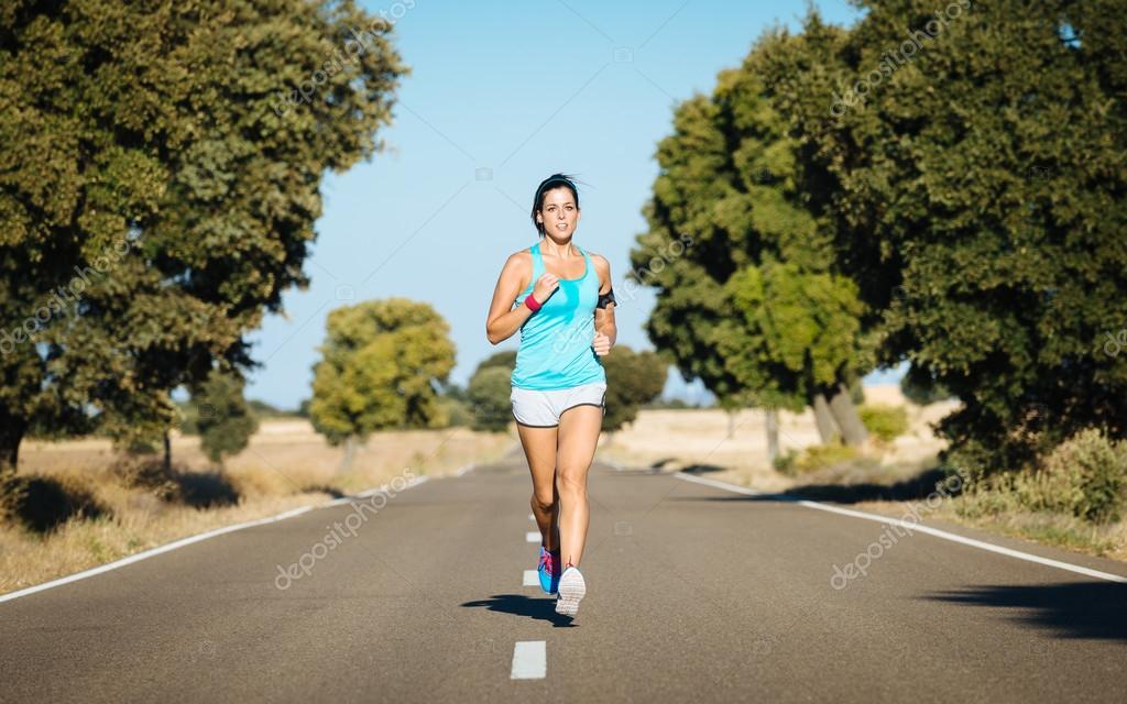 Woman running hard and and sweating — Stock Photo © Dirima #43991611