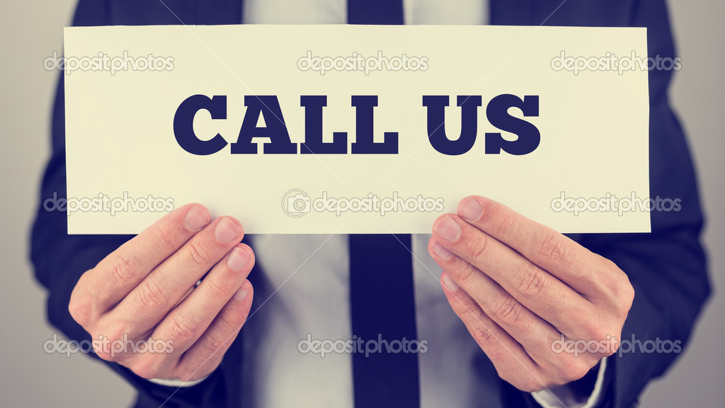Holding Call us sign — Stock Photo © Gajus-Images #47311651