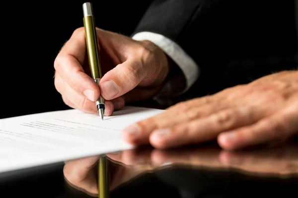 Business man signing a contract Stock Photo by ©Gajus-Images 20096709
