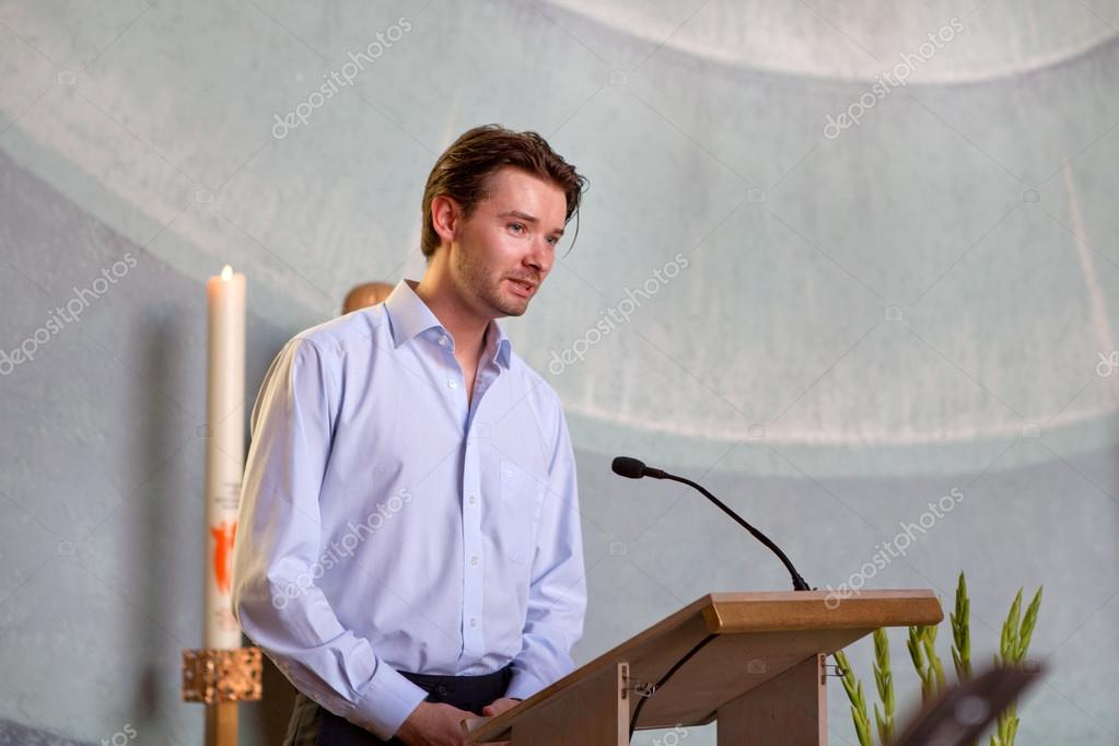 Young man preaching in catholic church — Stock Photo © romrodinka #14962673