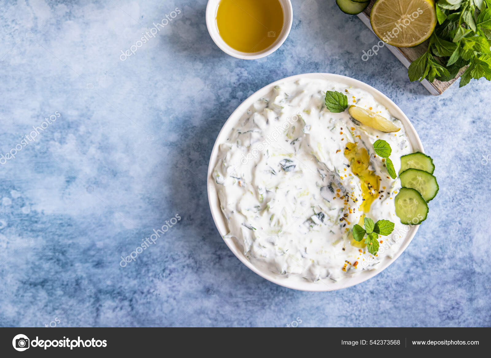 Indian or Pakistani raita sauce or dip with cucumber, yoghurt, garlic ...
