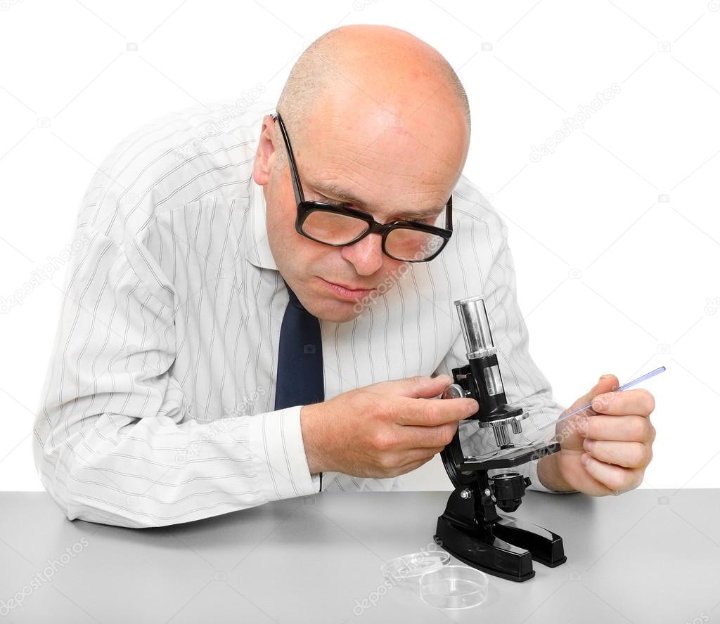 Male scientist with his microscope — Stock Photo © vladvitek #29590131