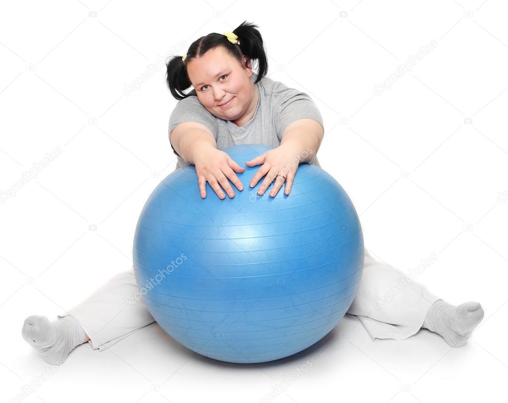 Happy overweight woman with blue ball exercising — Stock Photo ...