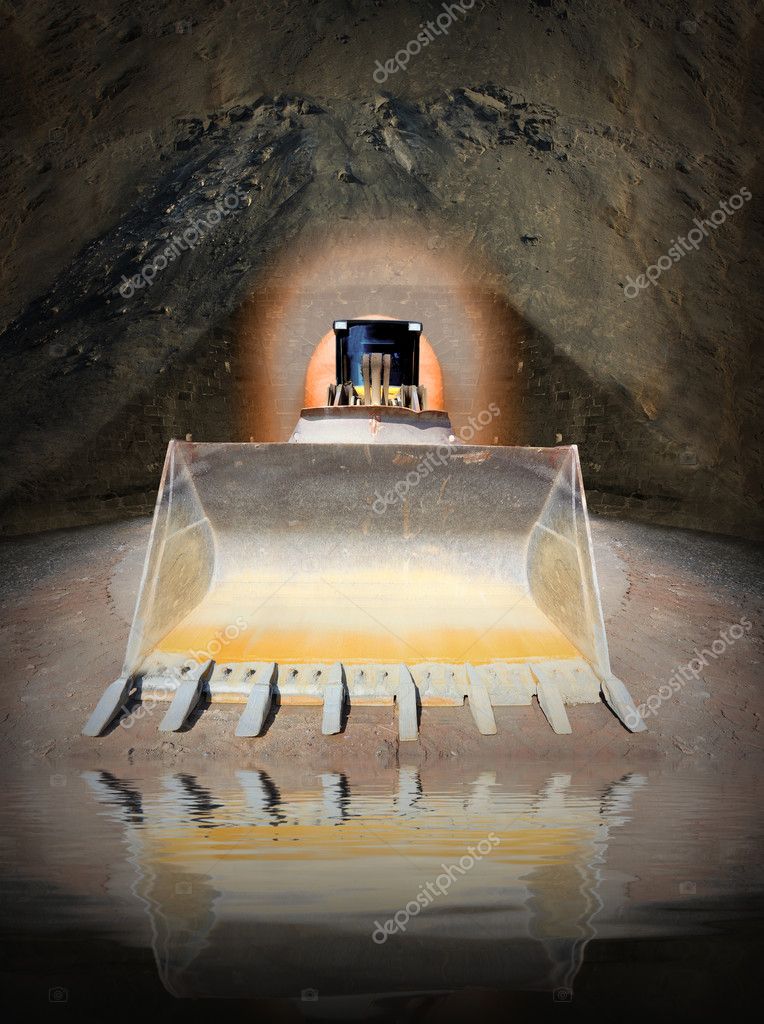 Excavator in digging hole — Stock Photo © vladvitek #33510527