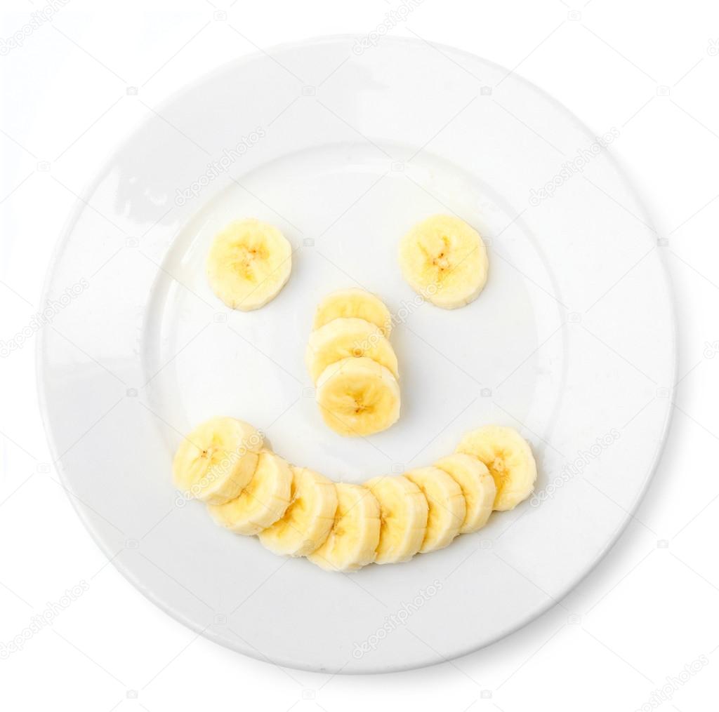 Emoticon smiley face from freshly sliced bananas on a plate Stock Photo ...