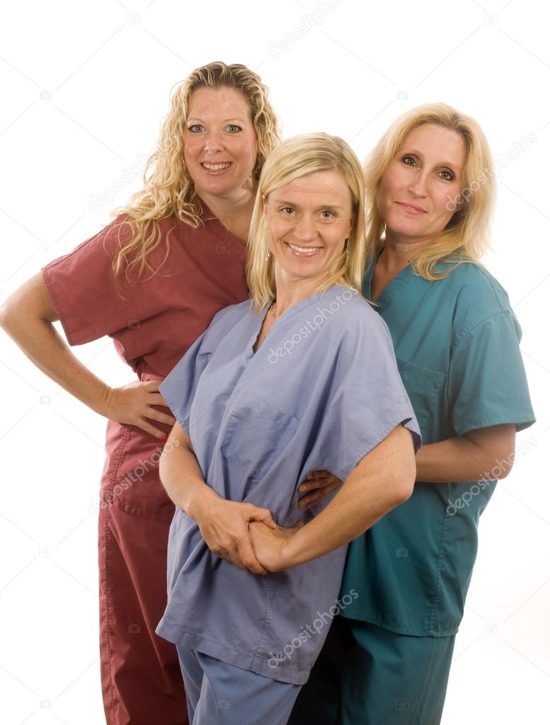 Three nurses in medical scrubs clothes Stock Photo by ©rjlerich 13411403