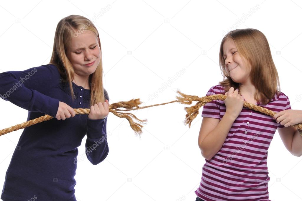 Two girls fighting over a rope — Stock Photo © carlosphotos #13910640