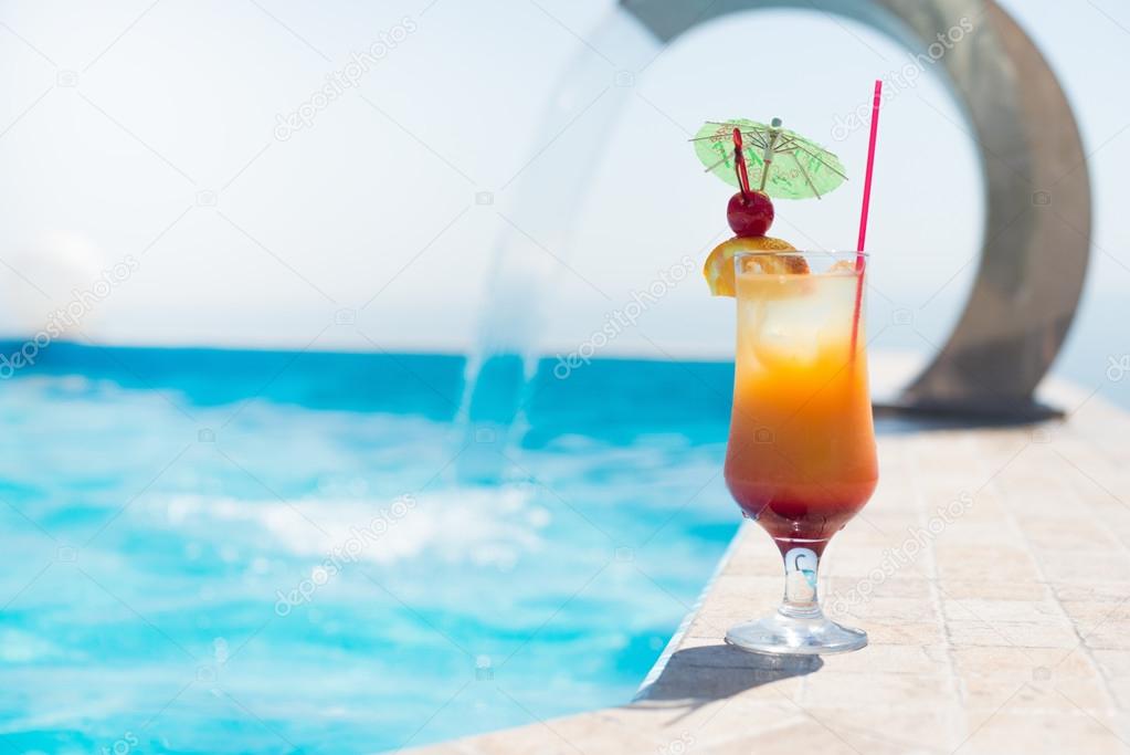 Cocktail near the swimming pool Stock Photo by ©nickolya 33073233