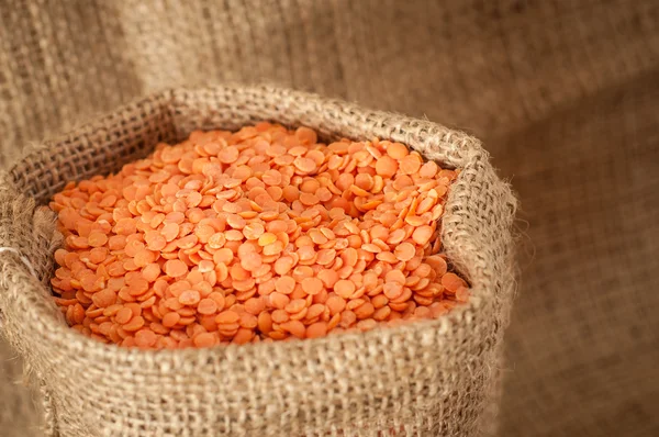 Raw moong dhal in jute bag and wooden scoup — Stock Photo © kk_tt #23513173