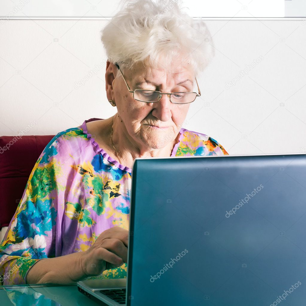 Senior woman using computer — Stock Photo © lilu1331 #33483503 Senior woman using computer — Stock Photo © lilu1331 #33483503